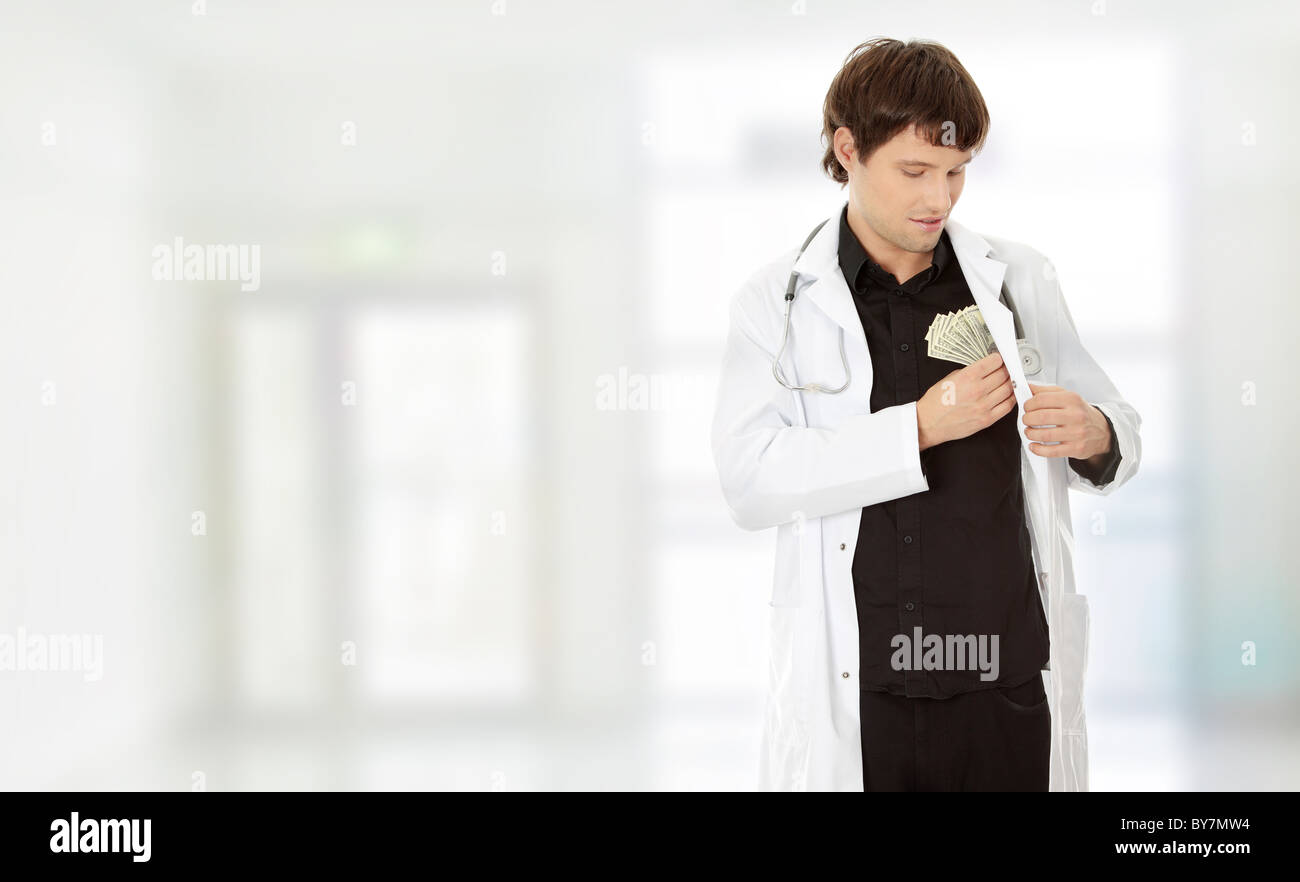 A handsome doctor with money Stock Photo - Alamy