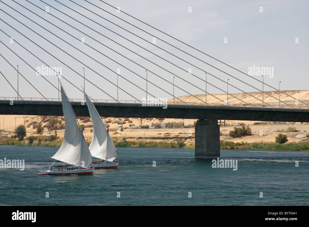 The bridge over the River Nile, at Aswan, Egypt, with feluccas Stock ...