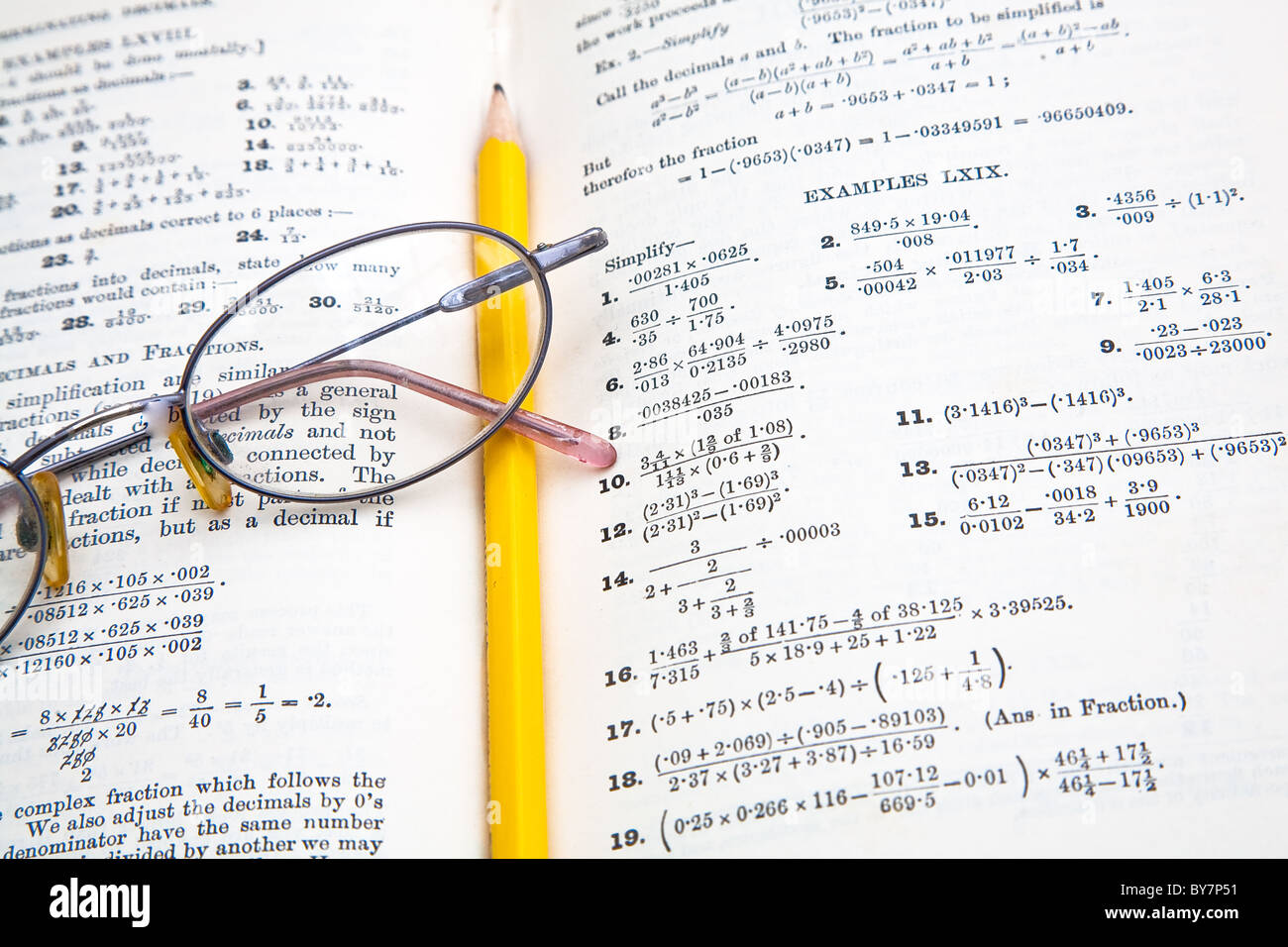 Open old fashioned mathematic textbook open with pencil and reading ...