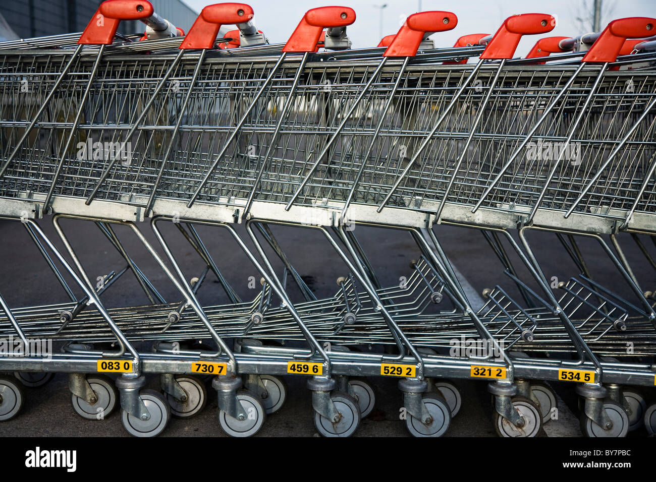 Row of parked trolleys Stock Photo - Alamy