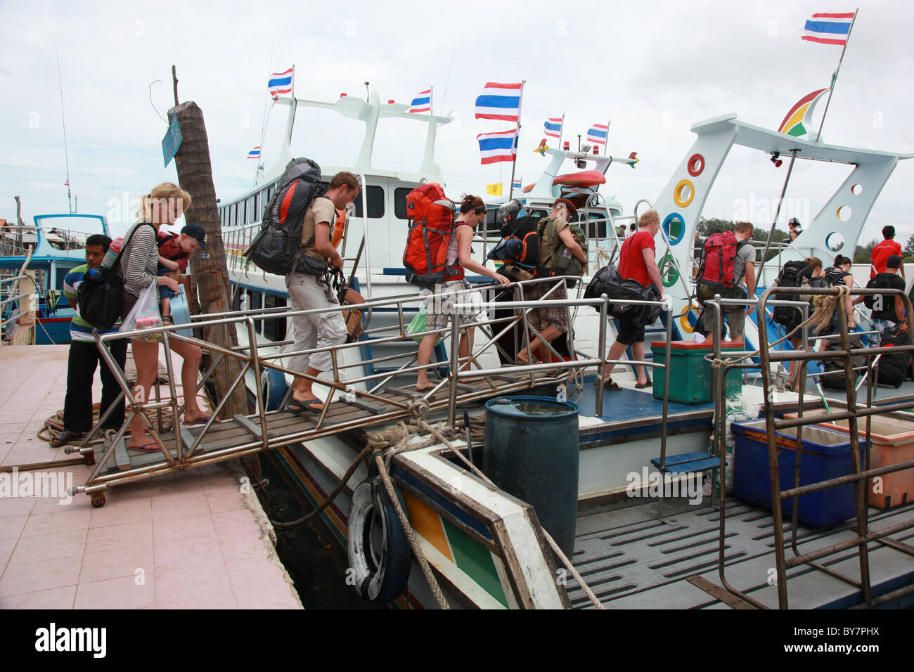 Passengers embarking a boat on holiday Stock Photo - Alamy