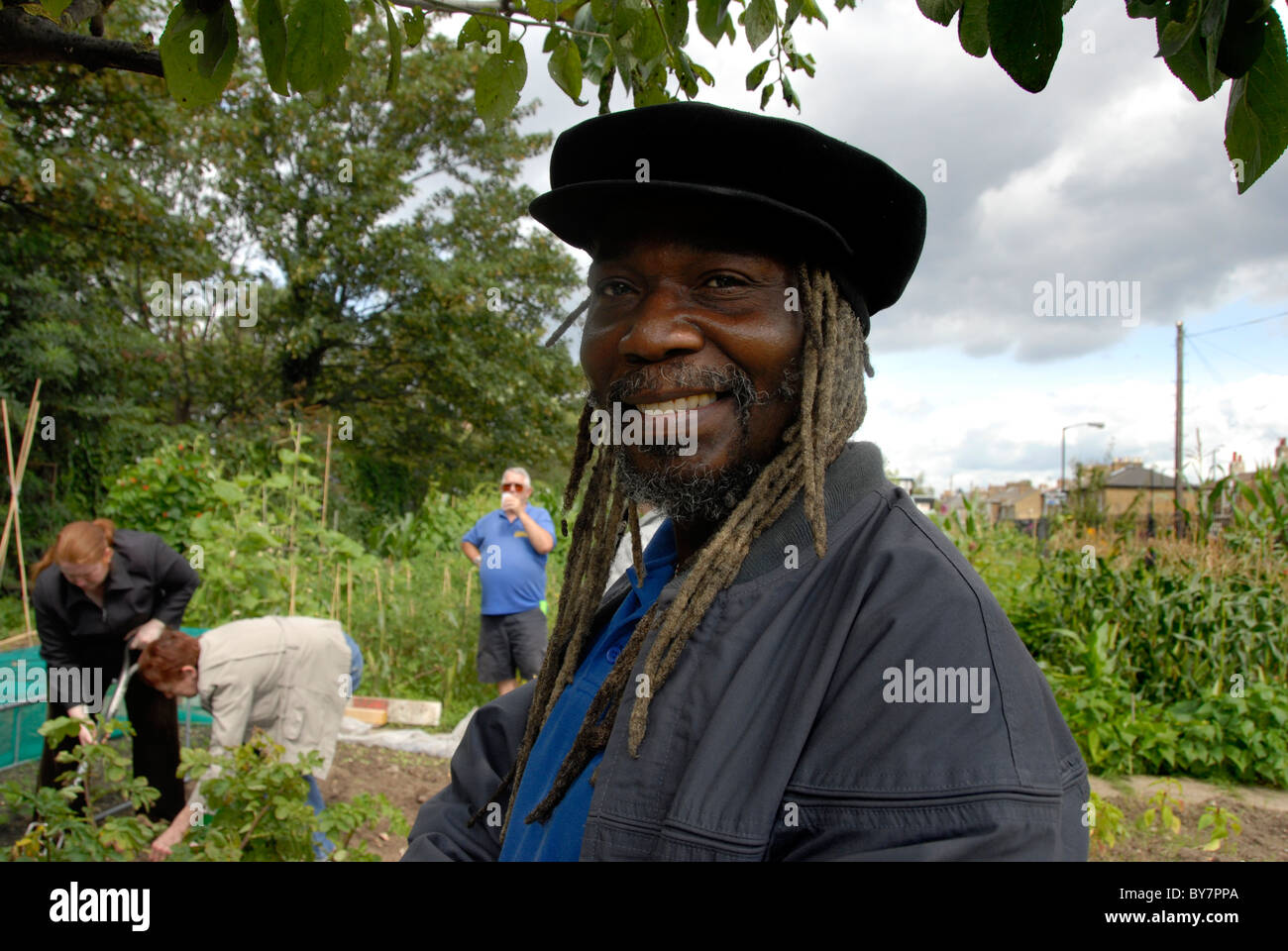 Rastafarian man working in Peckham allotment in South London Stock ...