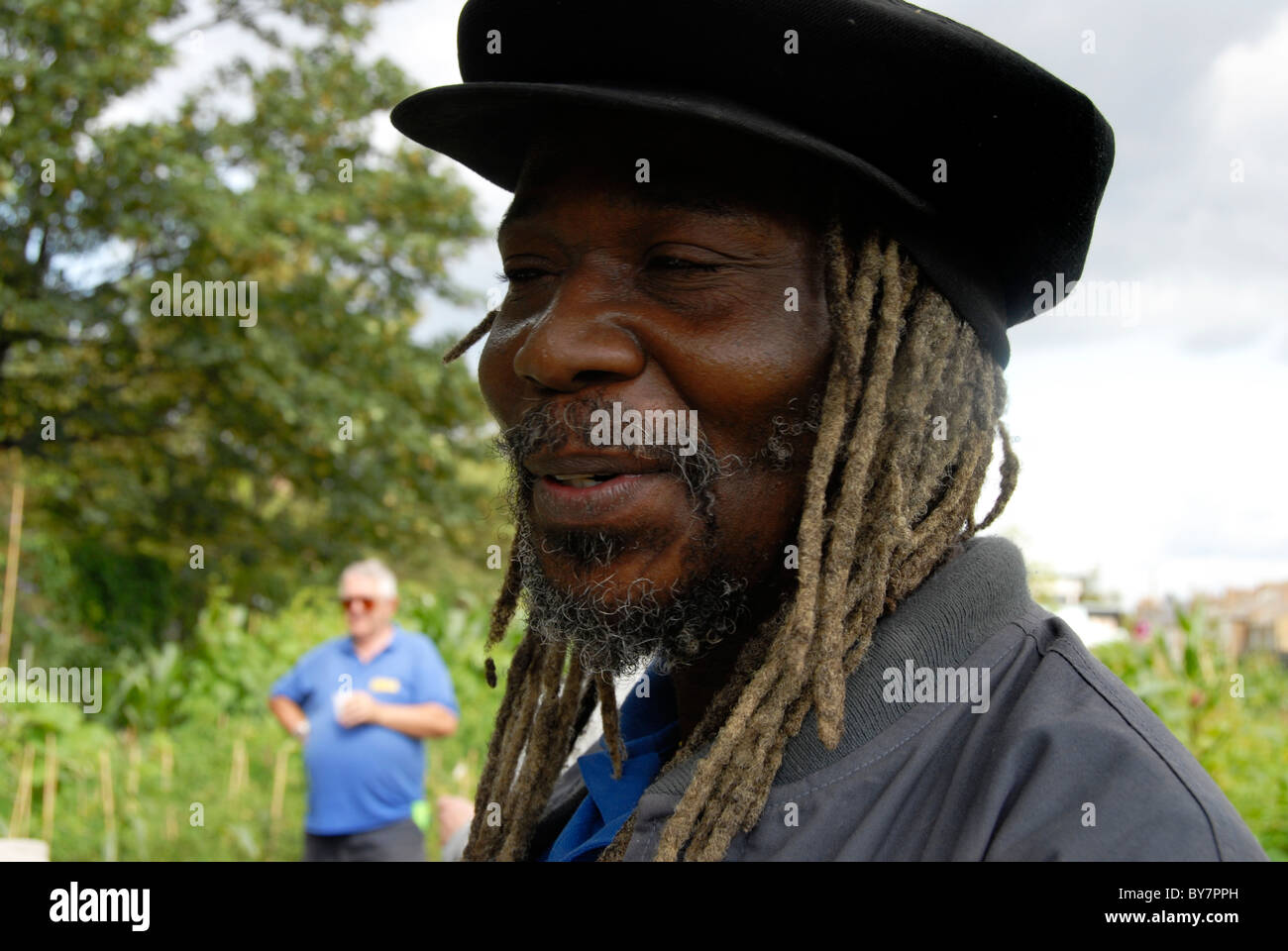 Rastafarian man working in Peckham allotment in South London Stock ...