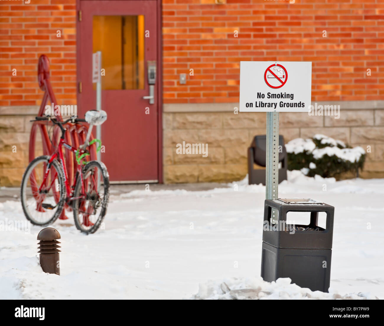 "No Smoking on Library Grounds" sign outside snowy Merrick Library, on ...