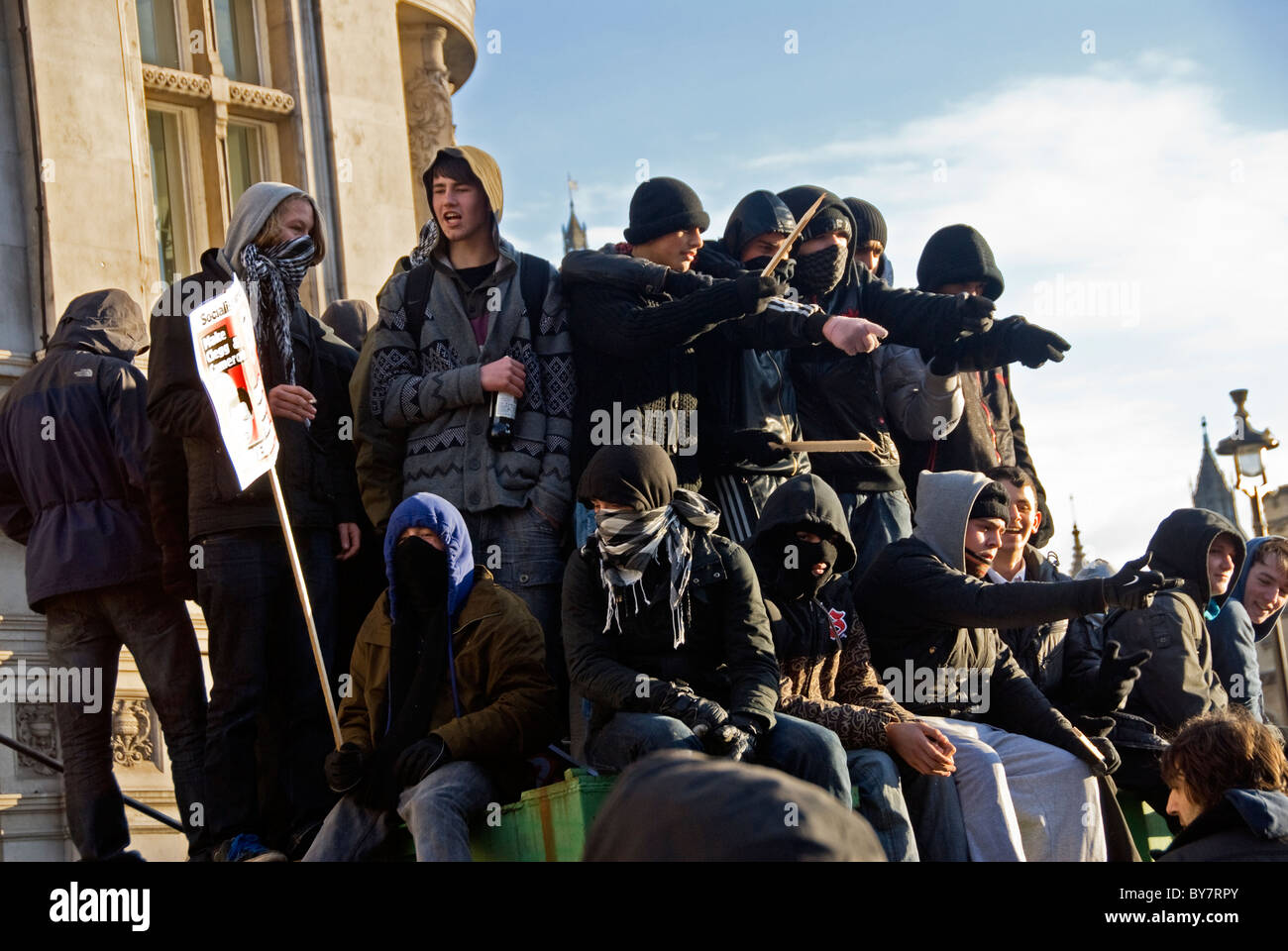 Group of hooded and masked youth hanging around the streets during ...