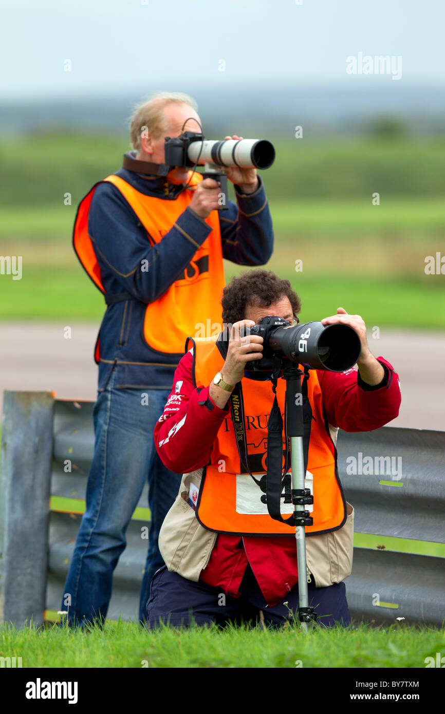 Motorsport Photographers photographing a motorcycle race Stock Photo ...
