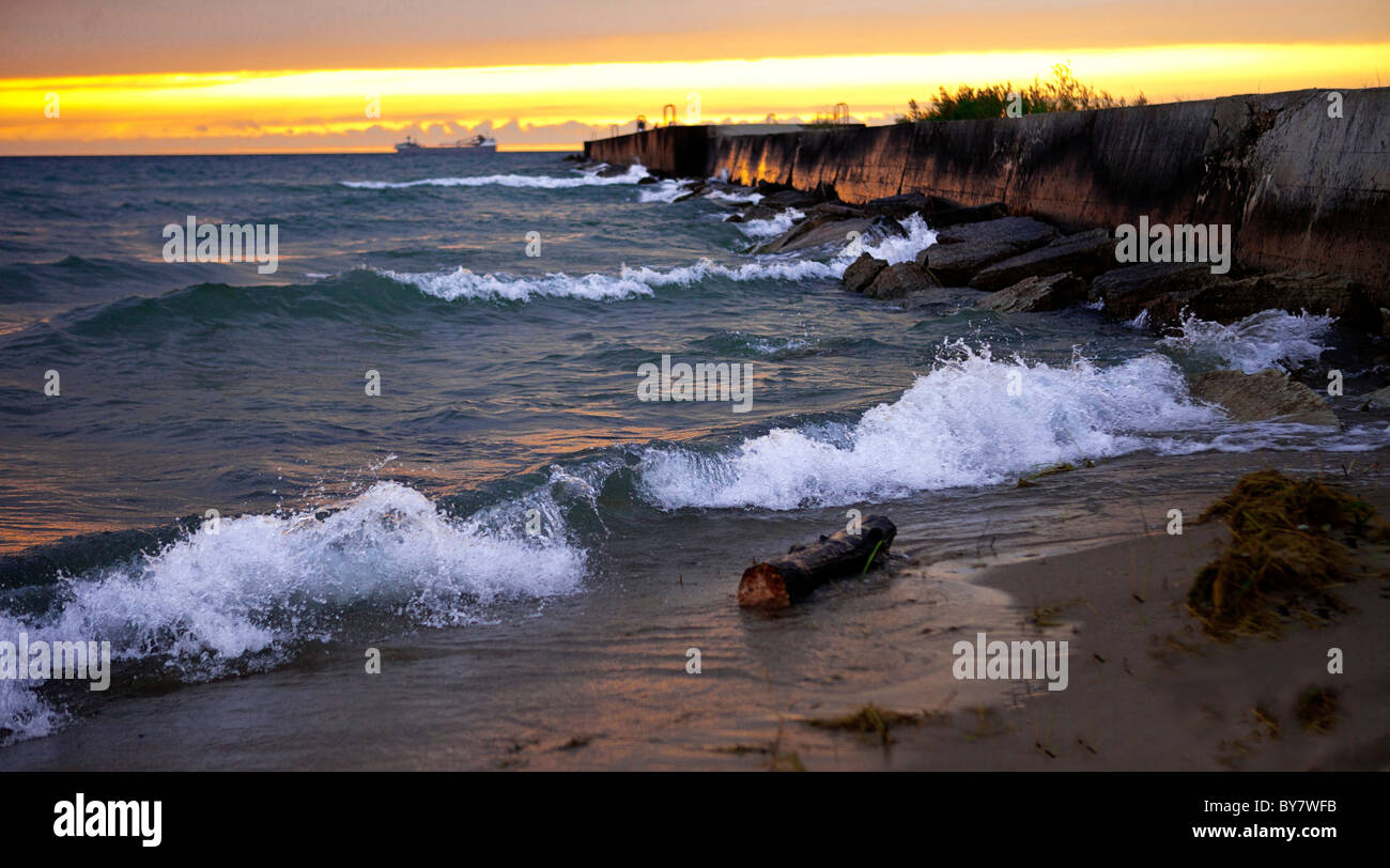 lake michigan sunset pier waves beach Stock Photo - Alamy