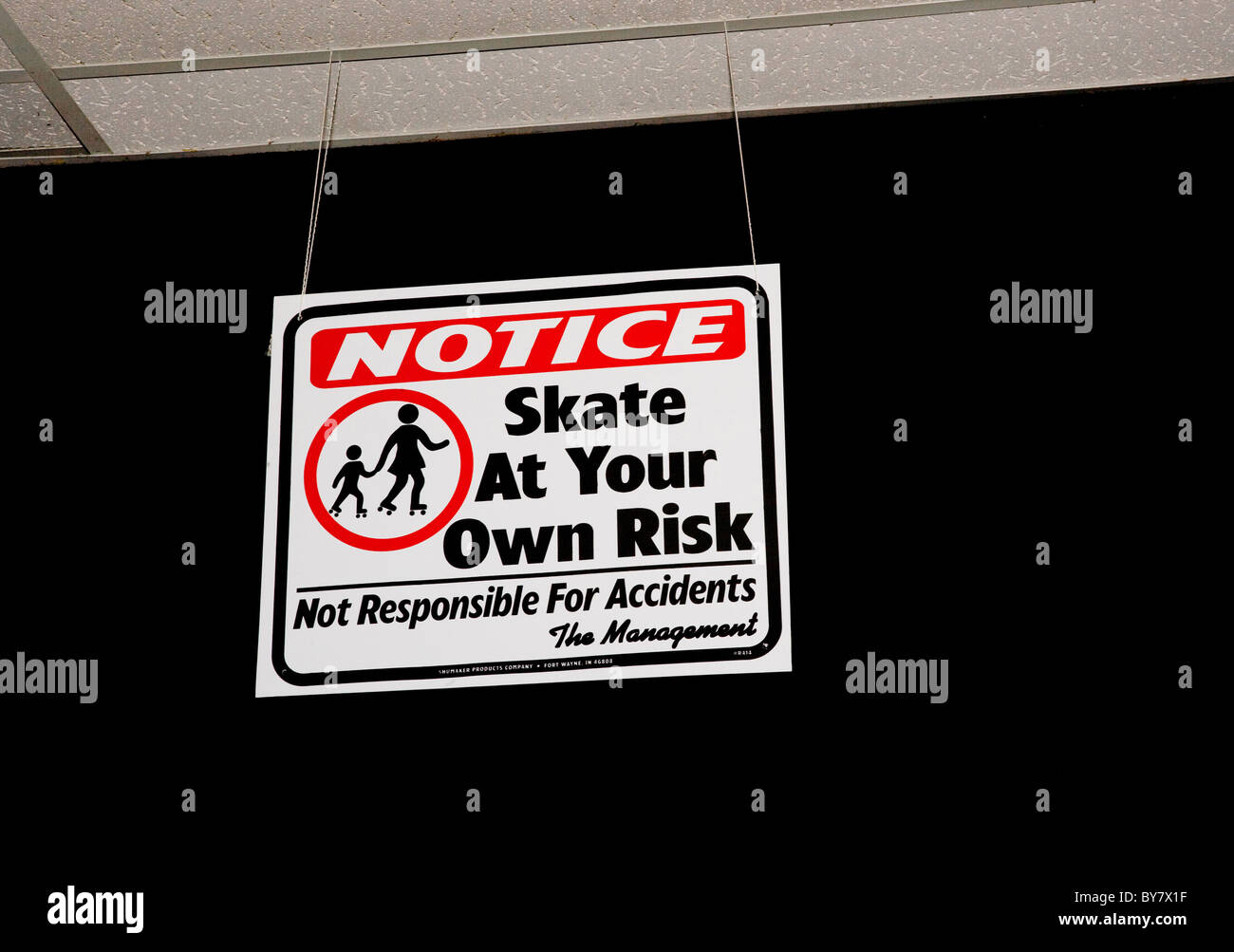 Sign on a wall in roller skate rink Skate at Your own Risk Stock Photo ...
