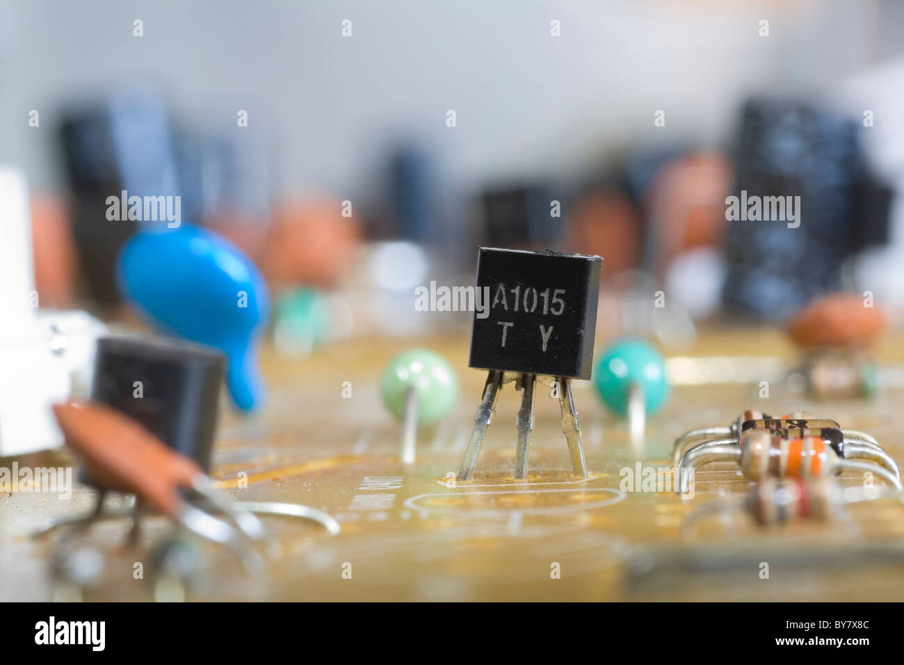 Miniature transistor on an electronic circuit board with components ...