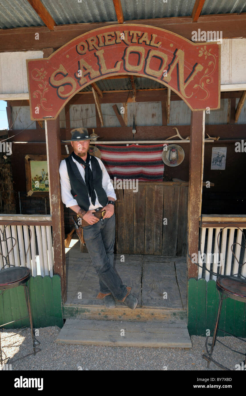Gunman with gun and holster in front of saloon Tombstone Arizona Stock ...
