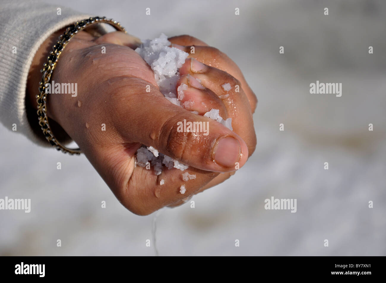 Salt in closed fist Stock Photo - Alamy