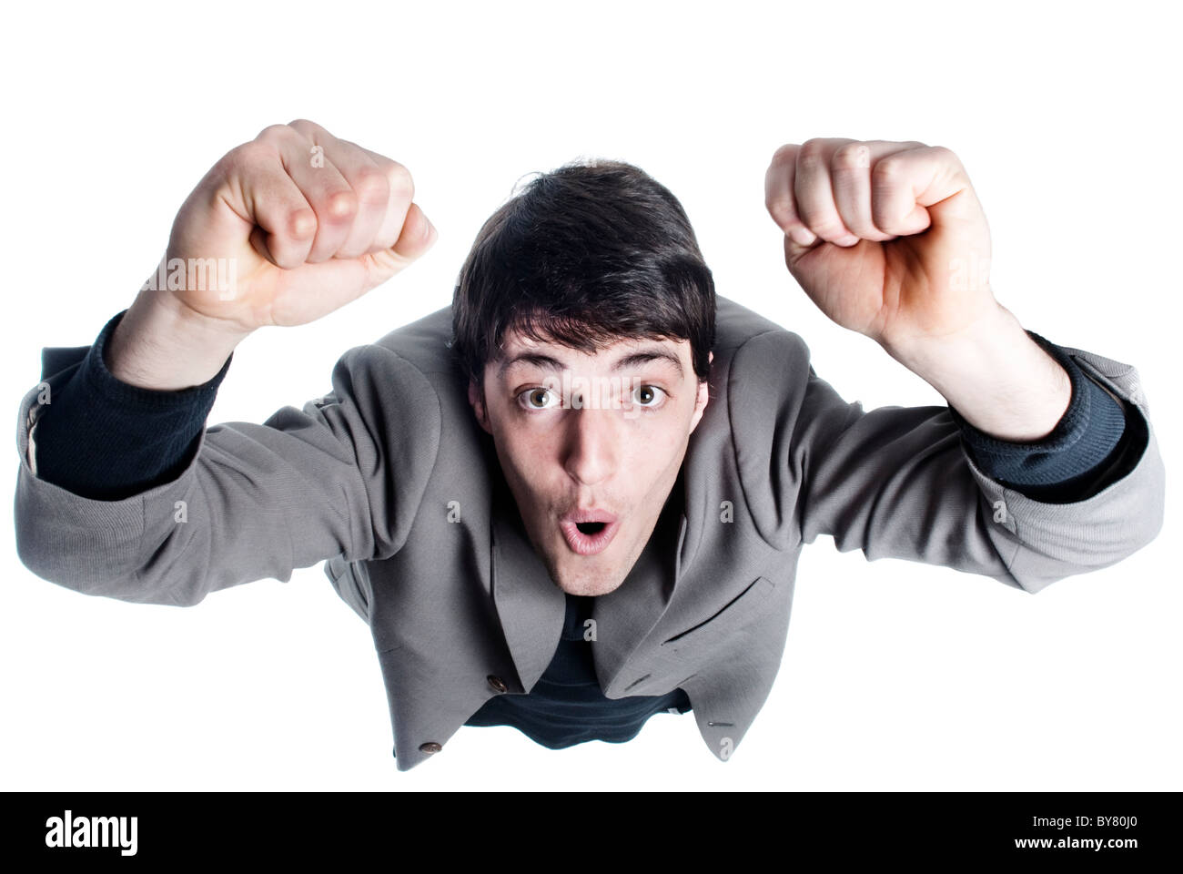 Businessman with lifted hands Stock Photo - Alamy