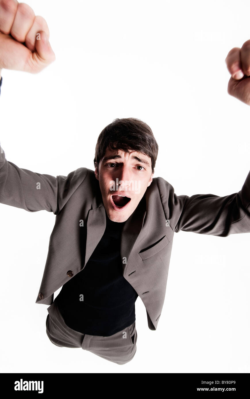 Businessman with lifted hands Stock Photo - Alamy