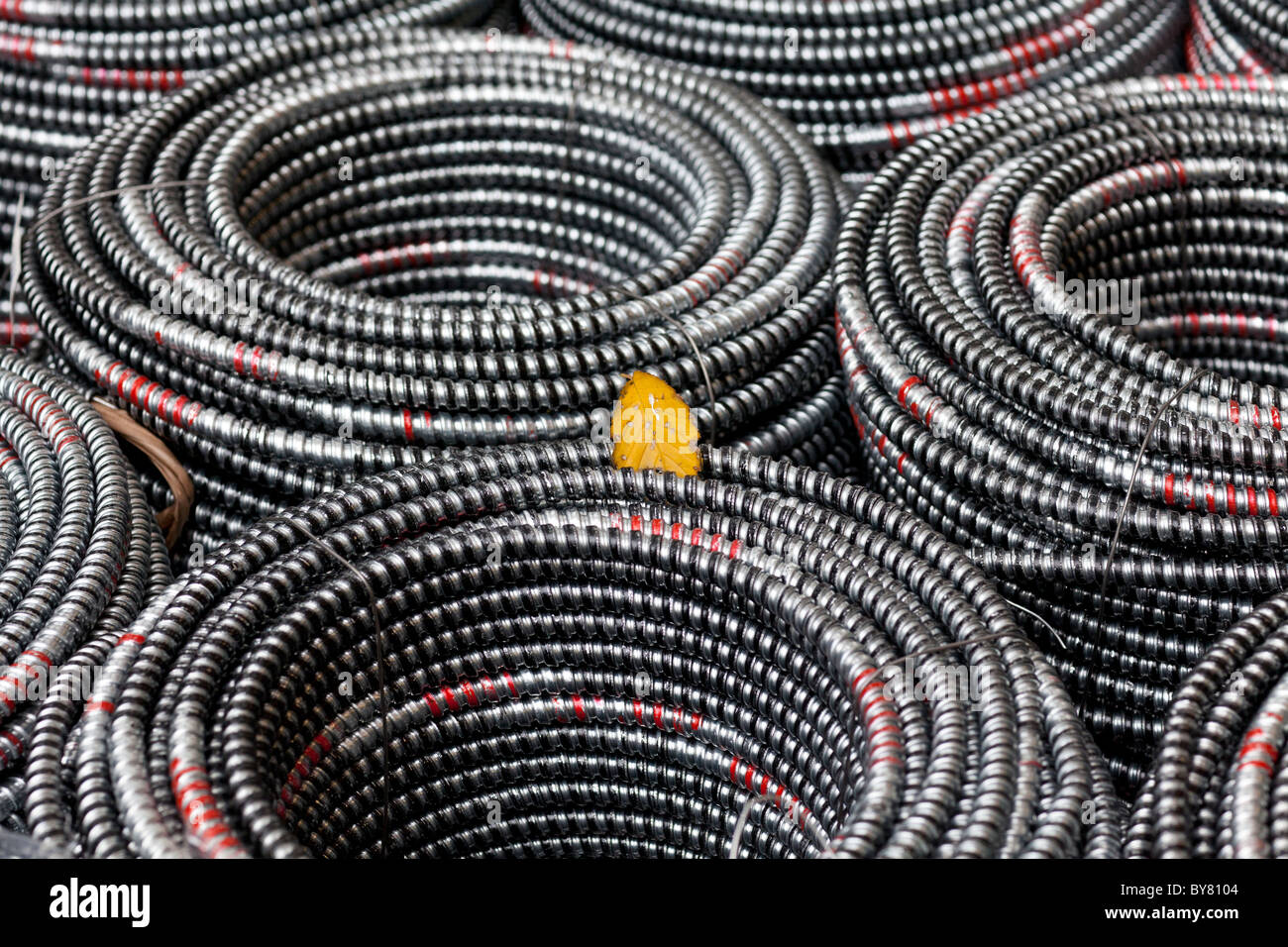 Coils of reinforced water pipe for kitchen appliances sitting on a ...