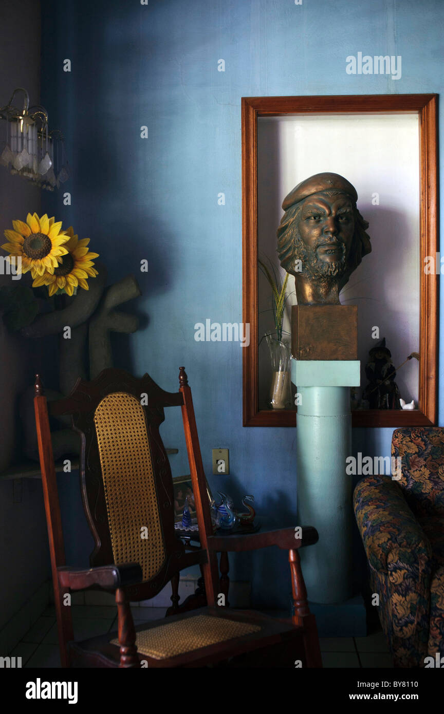 Cuban interior with bronze of Che Guevarra and and chair with sunflower ...