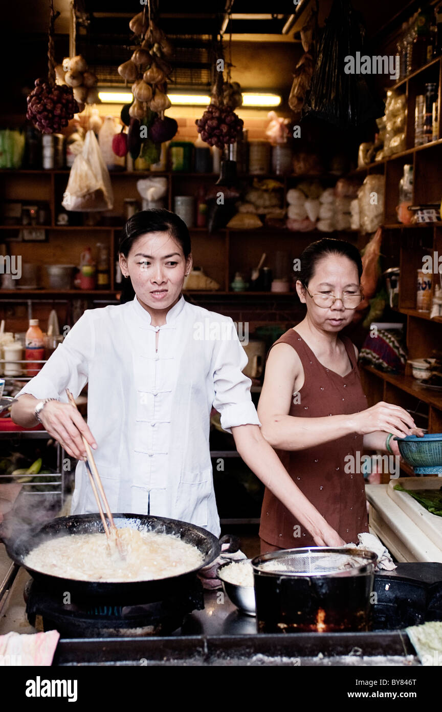 Vietnam, Saigon, chef cooks local oriental traditional delicacy of Rice ...