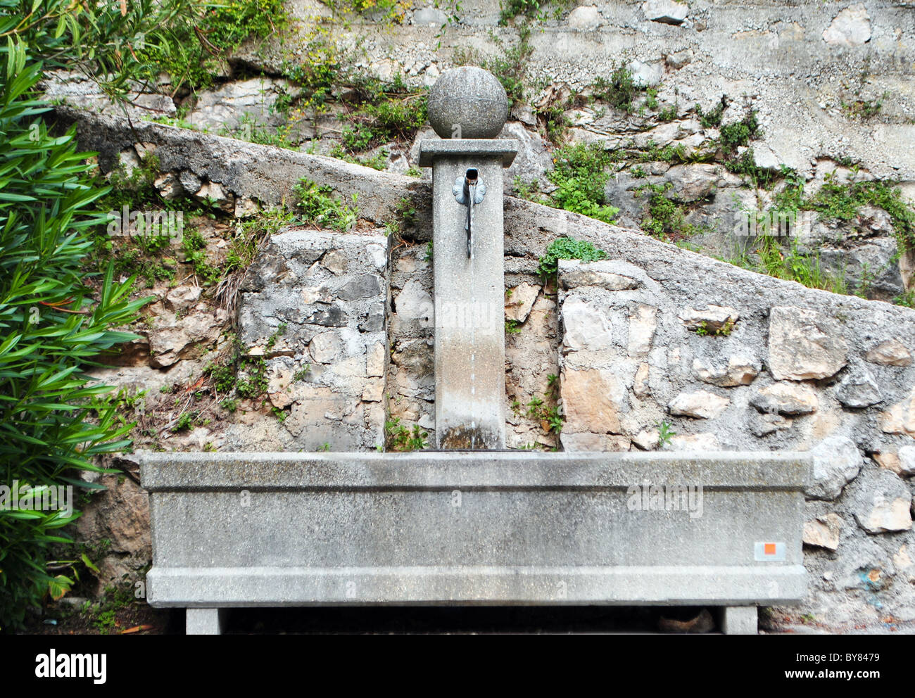 Rural fountain with spring water Stock Photo - Alamy