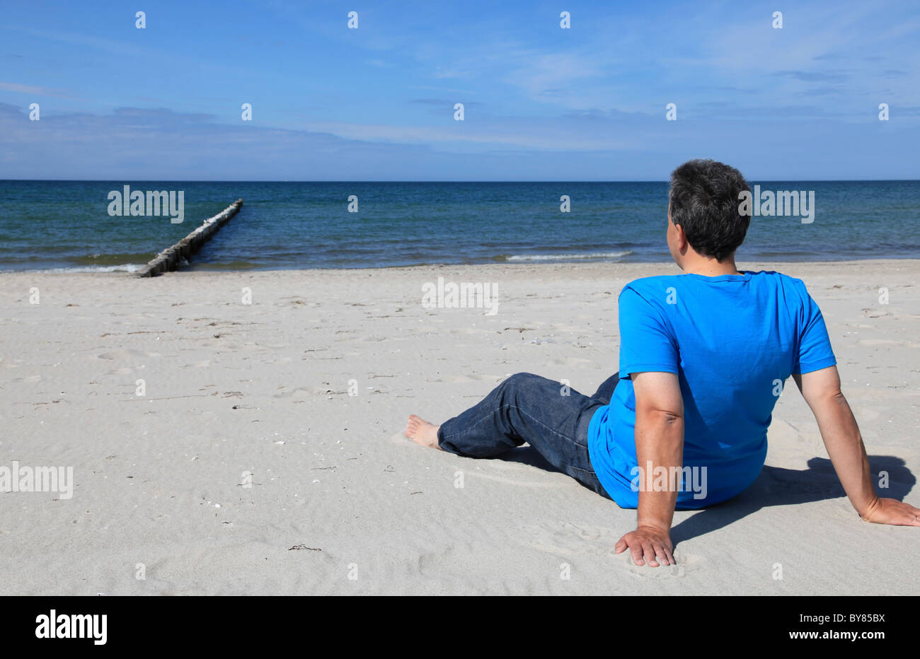 Man relaxing at the beach Stock Photo - Alamy