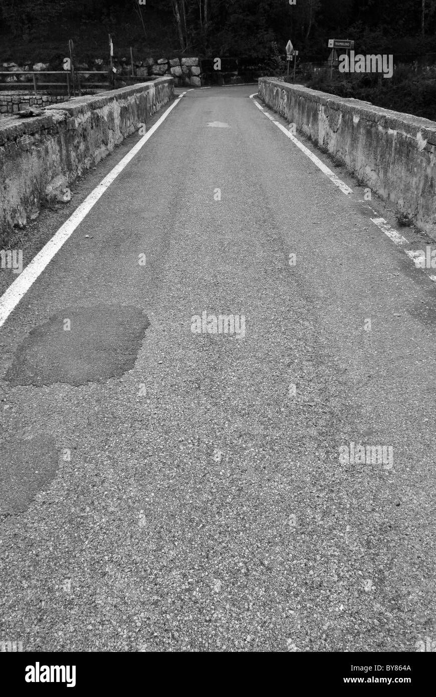 paved road with left turn Stock Photo - Alamy