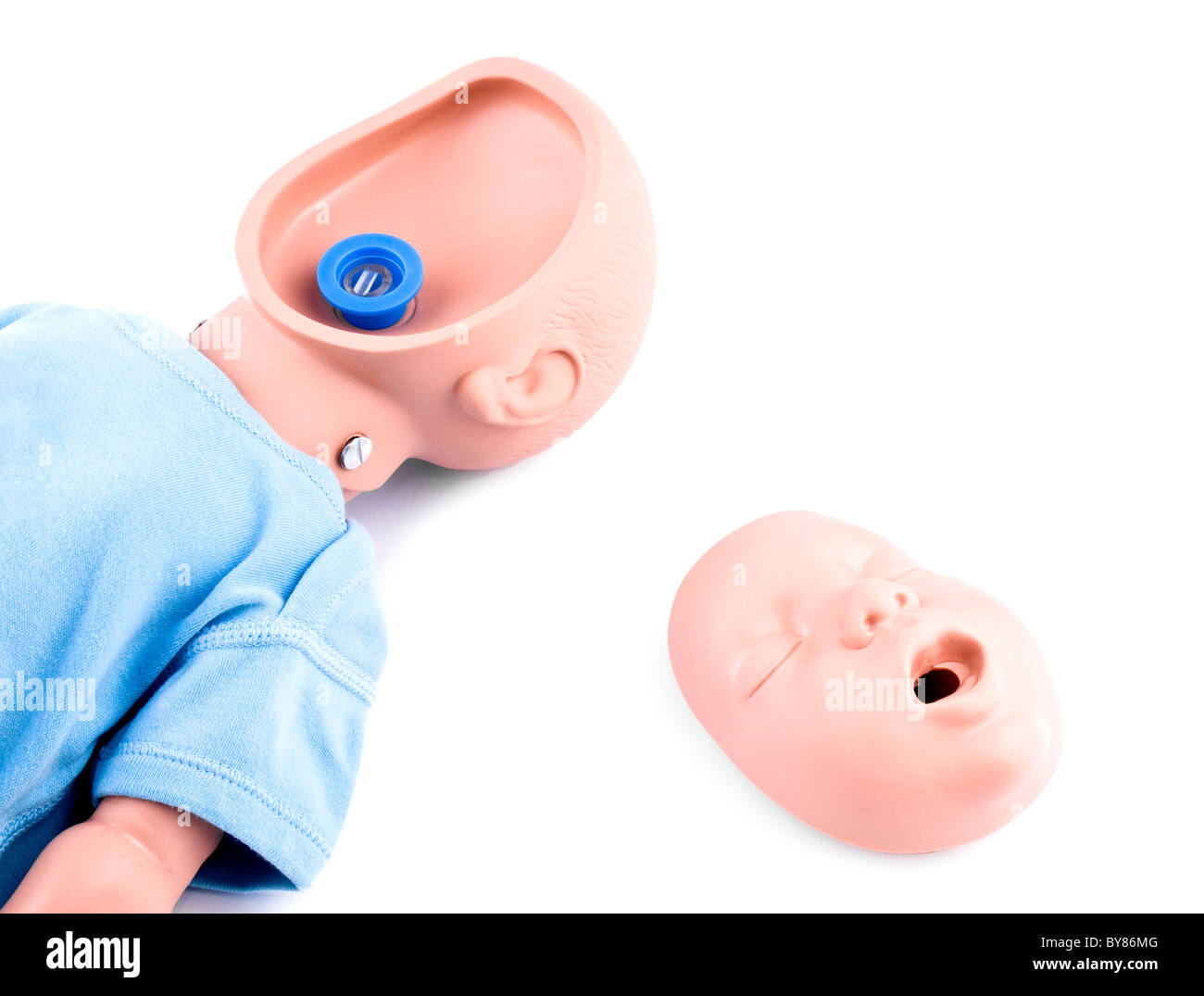 First aid training infant dummy on white background Stock Photo - Alamy