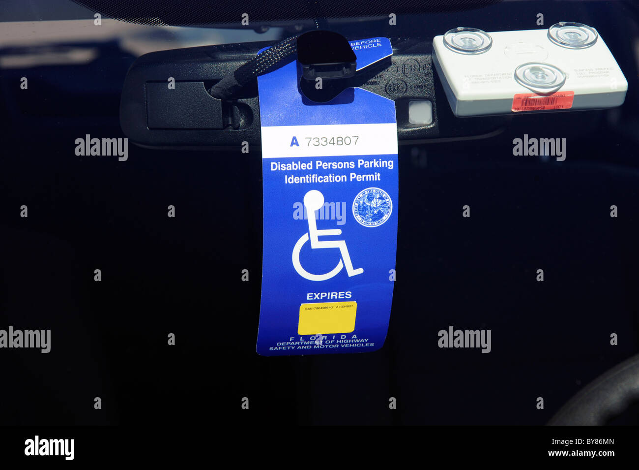 Handicapped permit in the windshield of an automobile Stock Photo - Alamy