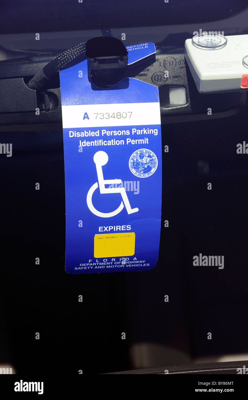 Handicapped permit in the windshield of an automobile Stock Photo - Alamy