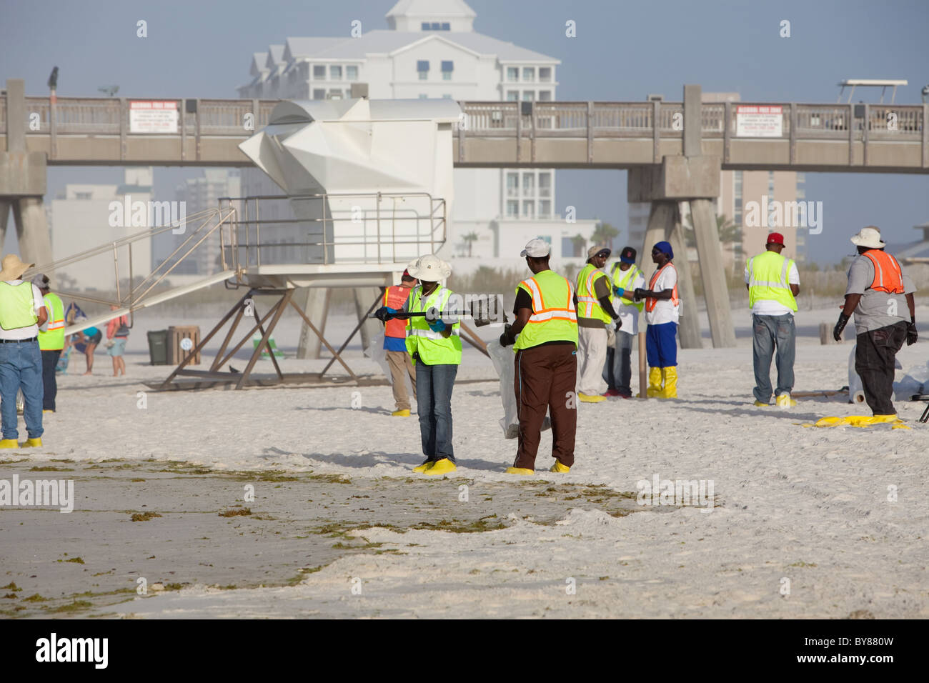 PENSACOLA BEACH - JULY 7: oil workers continue to clean the beach of ...