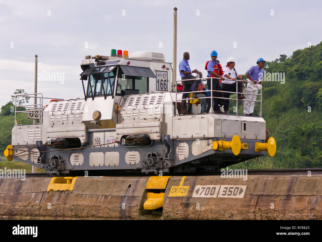 PANAMA - Workers and electric locomotive also known as a mule ...