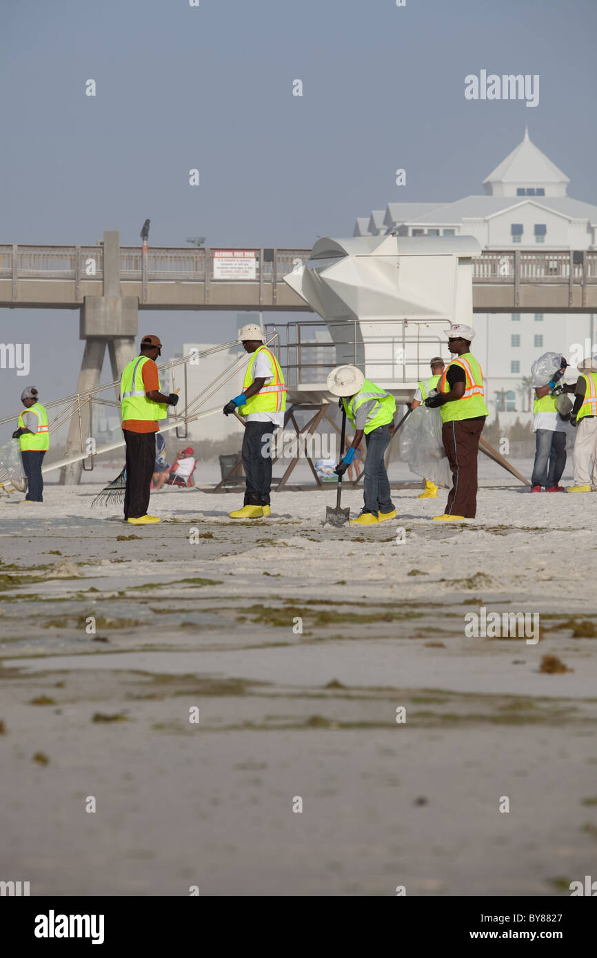 PENSACOLA BEACH - JULY 7: oil workers continue to clean the beach of ...