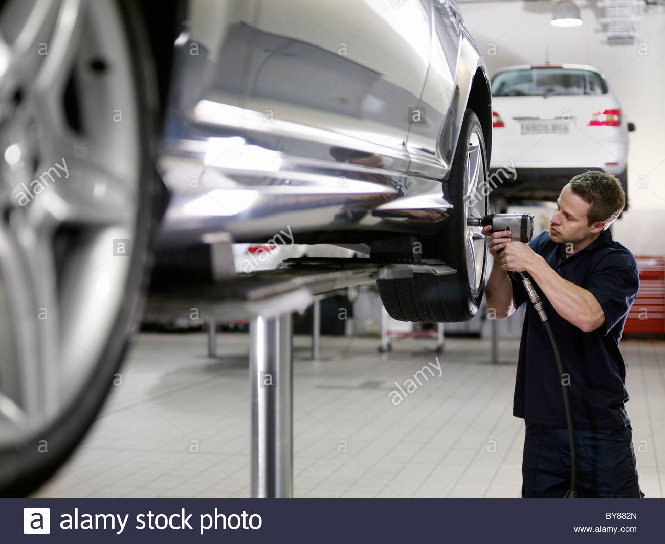 Mechanic Working On Car Stock Photos & Mechanic Working On Car Stock ...