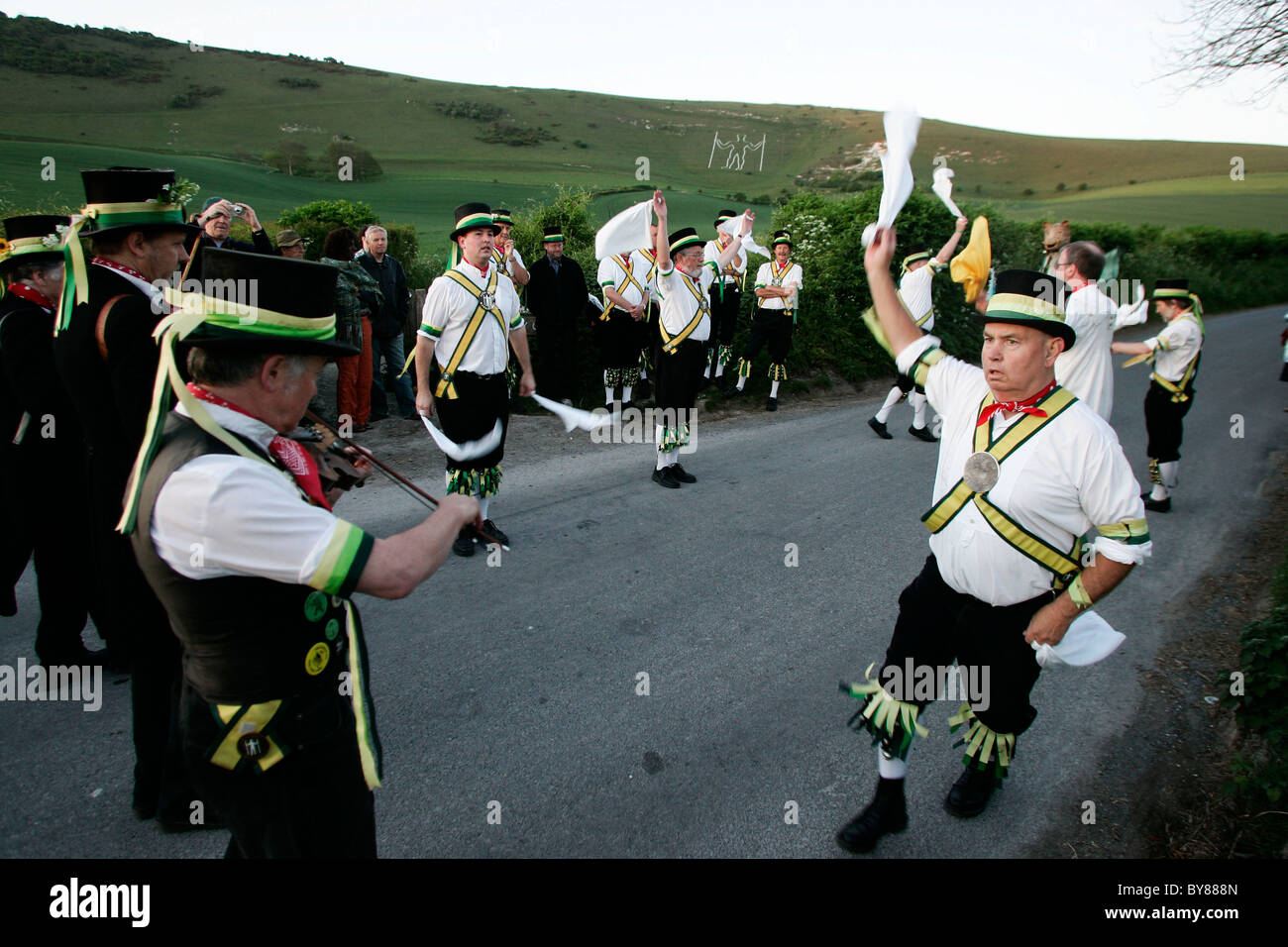 Long Man Morris Men dance at the foot of the Long Man of Wilmington as ...