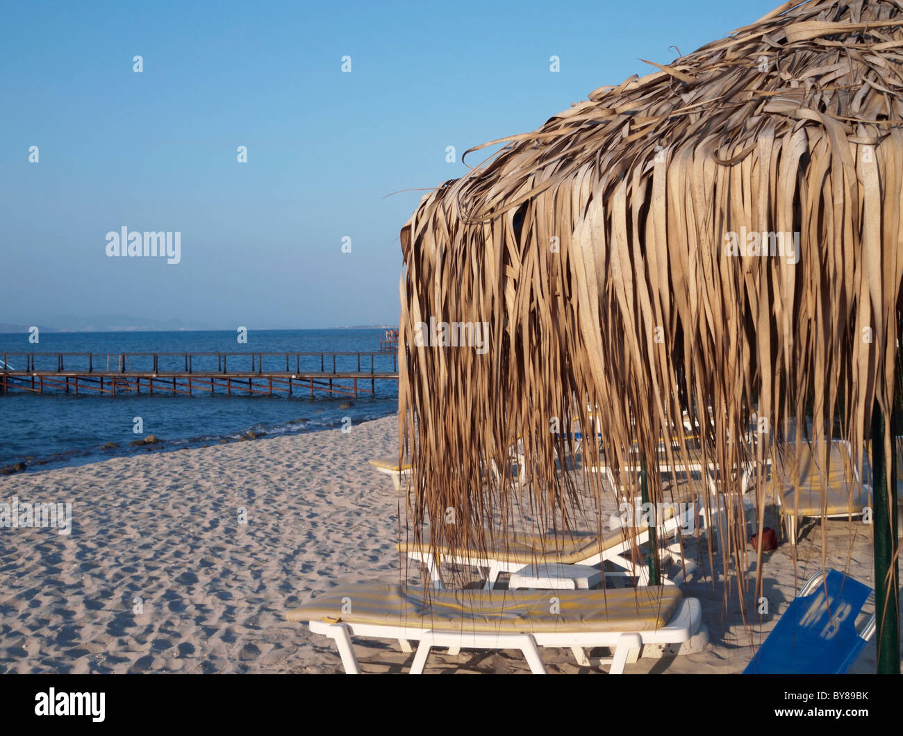 parasol with leaves and deckchairs - Mastihari - Kos - Greece Stock ...