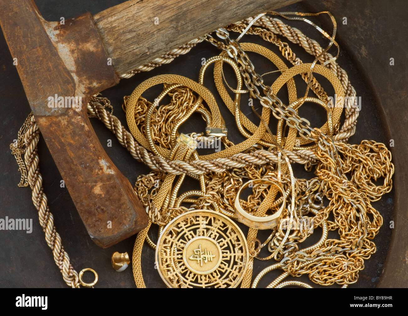 Closeup of scrap gold in goldpan with old mining pick Stock Photo - Alamy