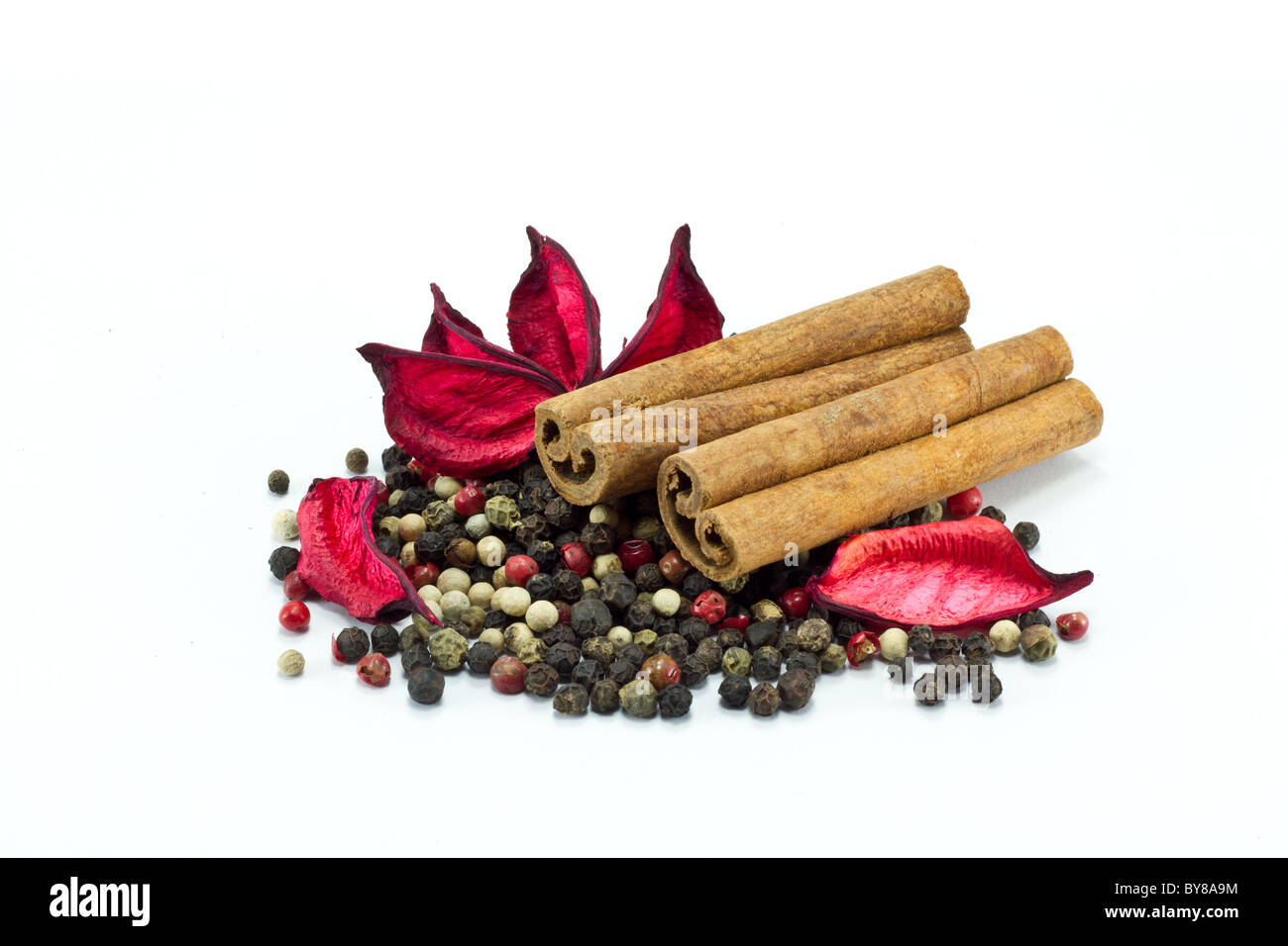 Closeup of mixed pepper and cinnamon sticks Stock Photo - Alamy