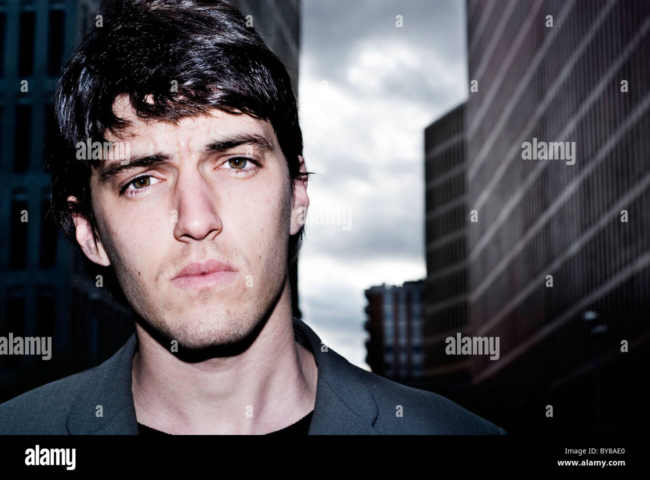 Suited businessman suited and thoughtful Stock Photo - Alamy