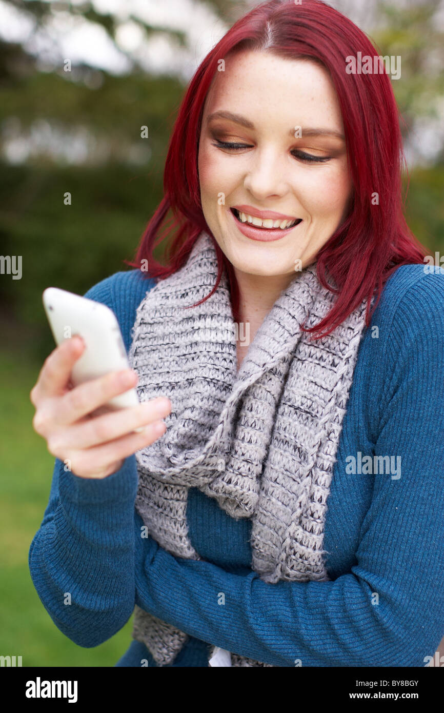 Girl looking message on phone Stock Photo - Alamy