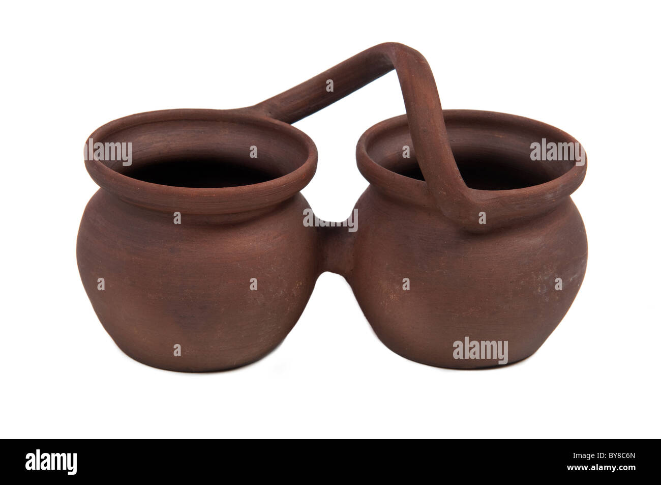 Two empty clay pots with a combined handle Stock Photo - Alamy