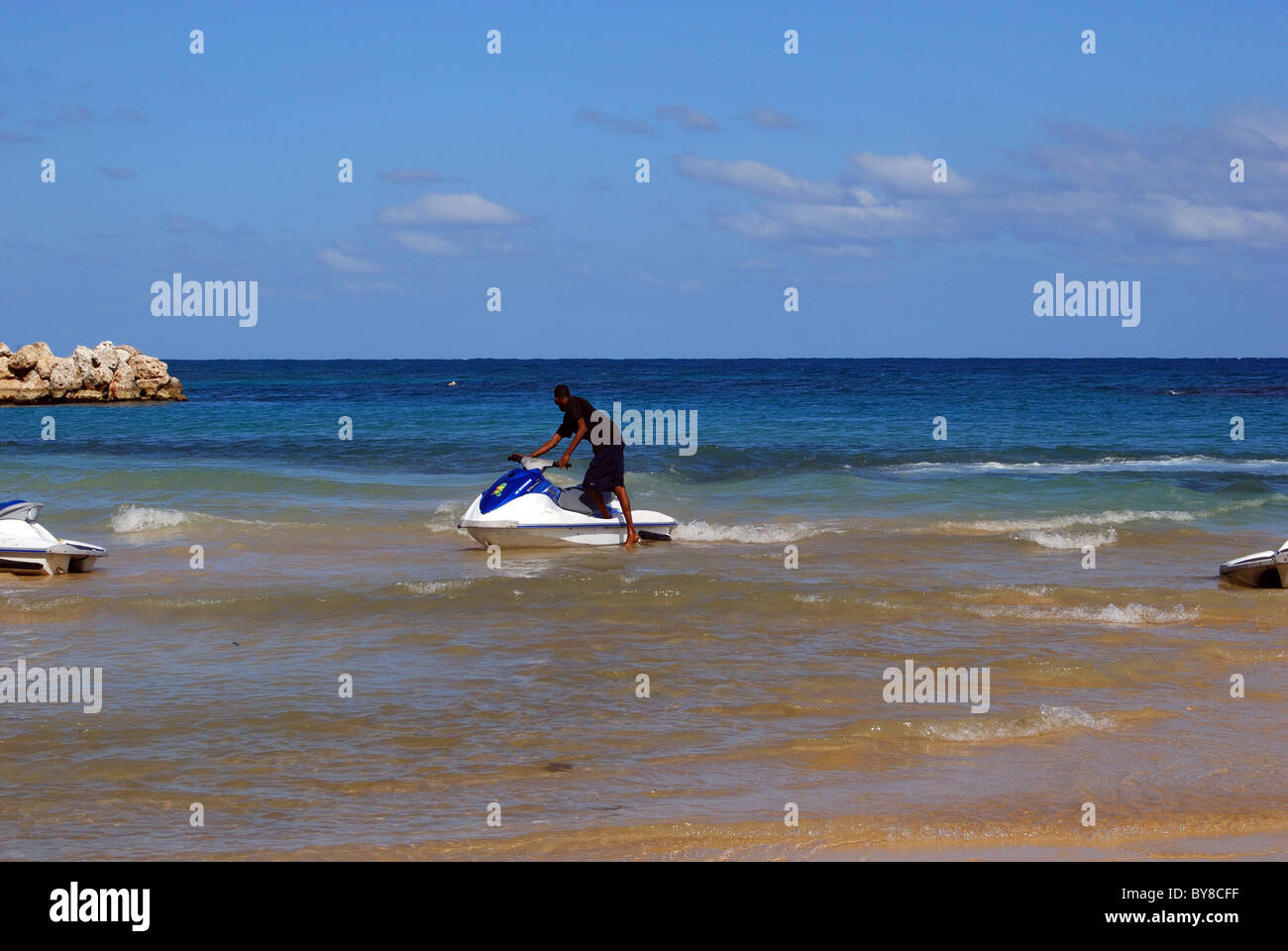 Jet skier on the shoreline, Ocho Rios, Middlesex County, Jamaica ...