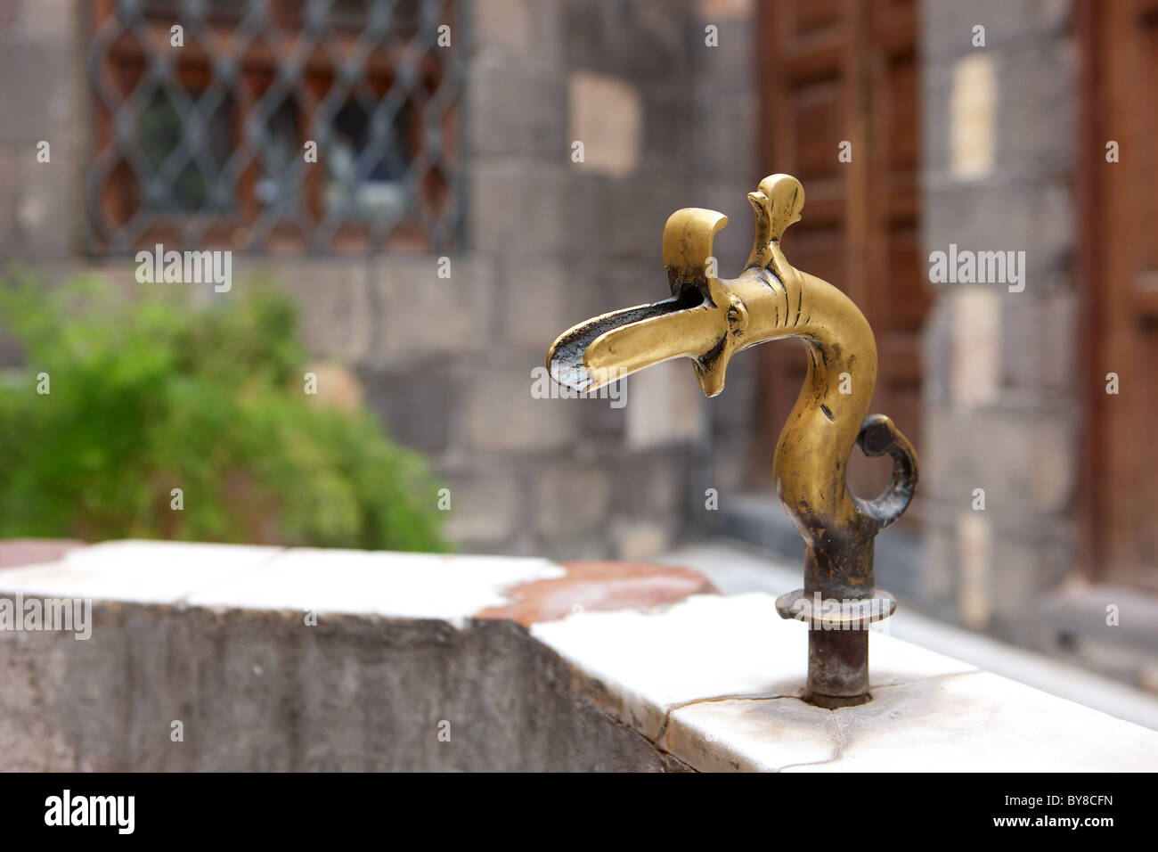 Traditional sea-horse waterspout on fountain of Bait Nizam palace ...