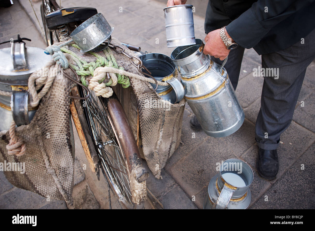 Fresh milk delivery in Damascus street Stock Photo - Alamy