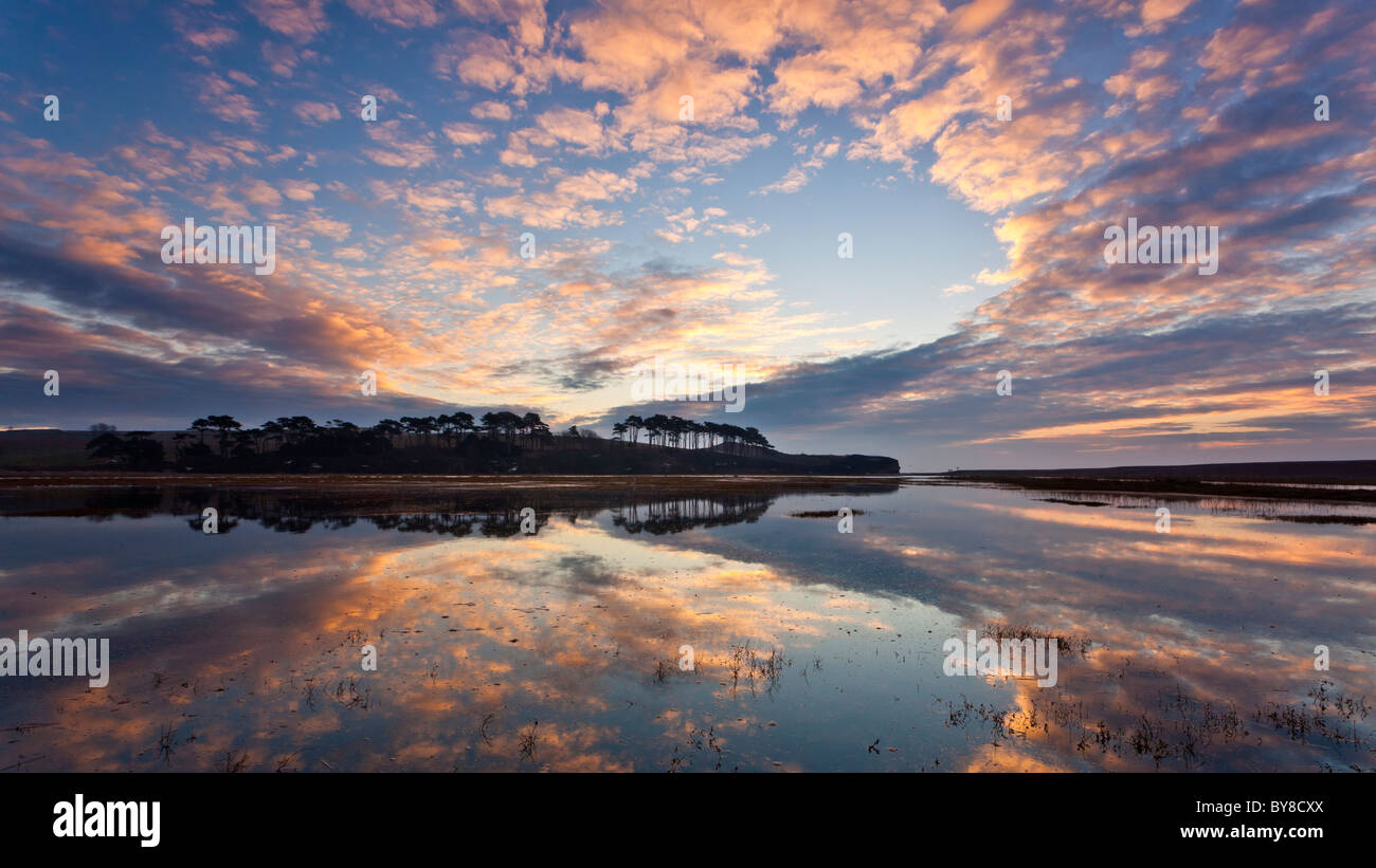 The River Otter at Budleigh Salterton at high tide just after sunrise ...