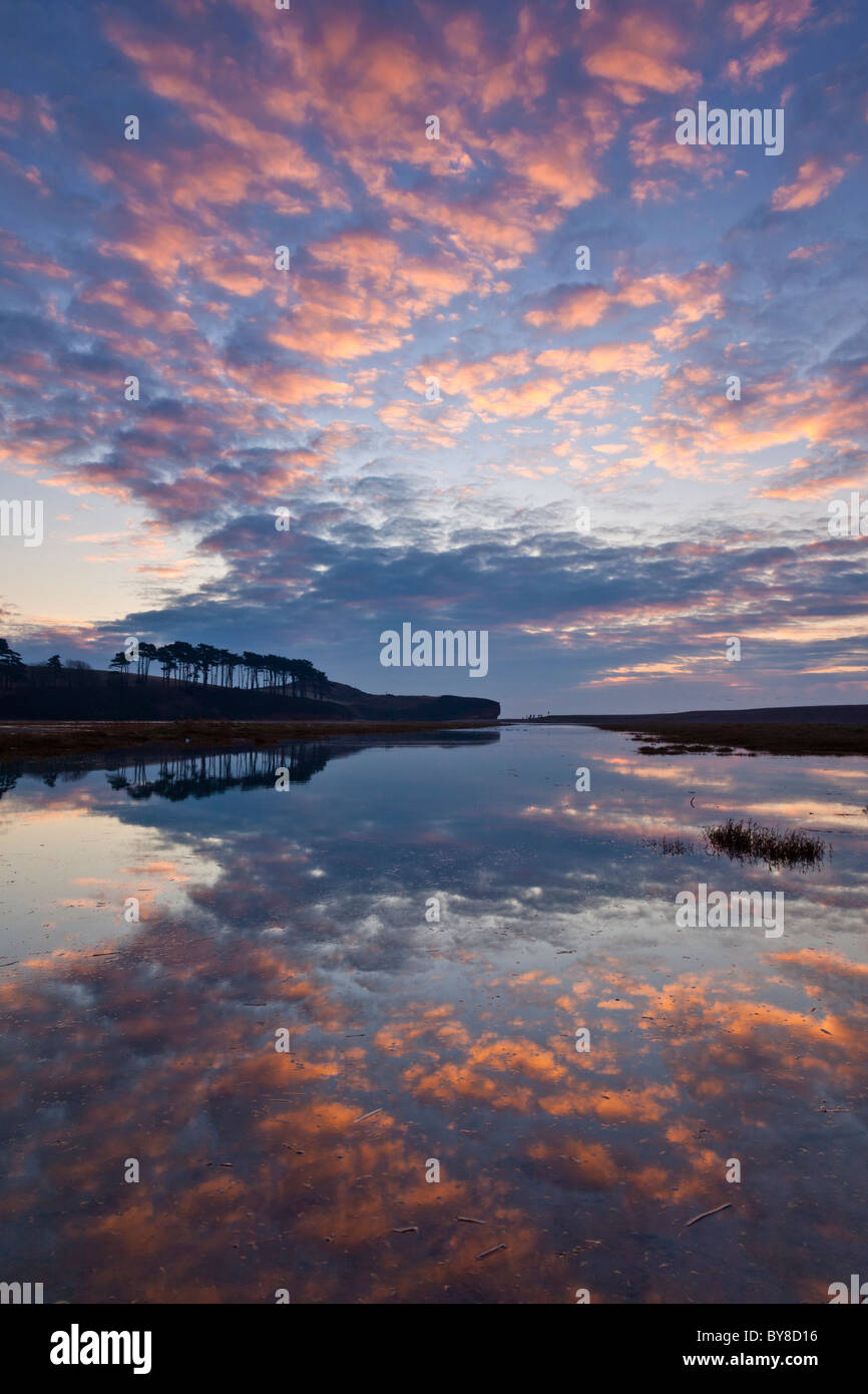 The River Otter at Budleigh Salterton at high tide just after sunrise ...