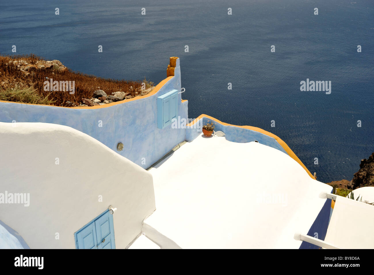 Roof terrace of a house at Oia on the Greek island of Santorini in the ...
