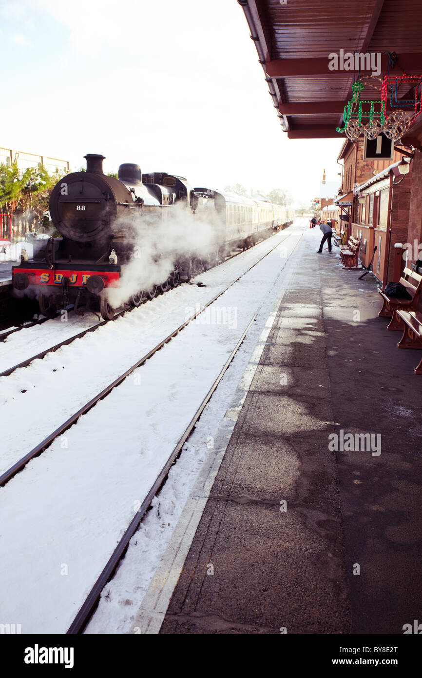 Steam train in the snow Stock Photo - Alamy