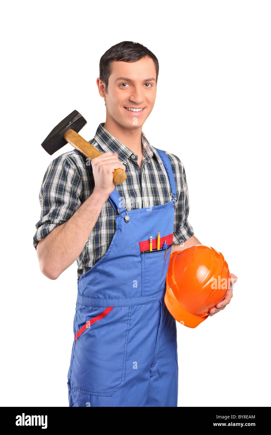 Male worker wearing blue overall with a hammer and helmet Stock Photo ...