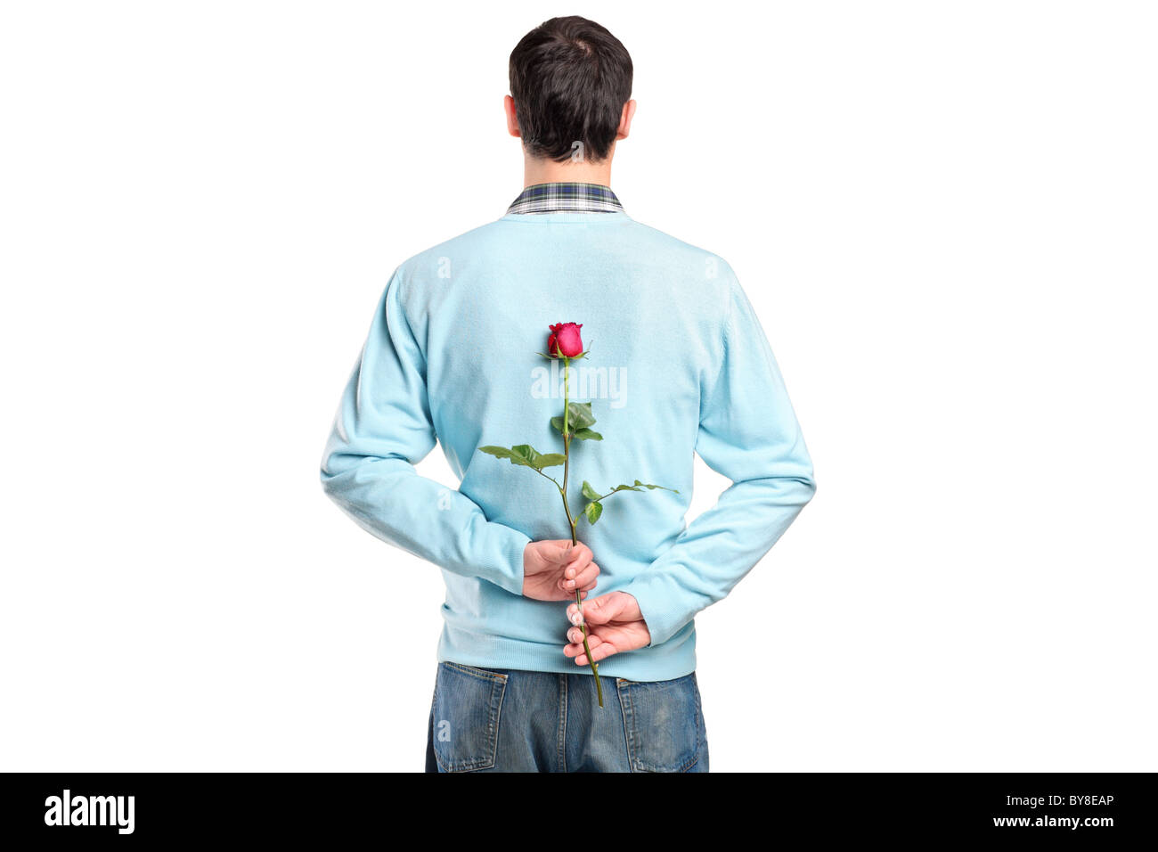 Boy holding flower behind back hi-res stock photography and images - Alamy