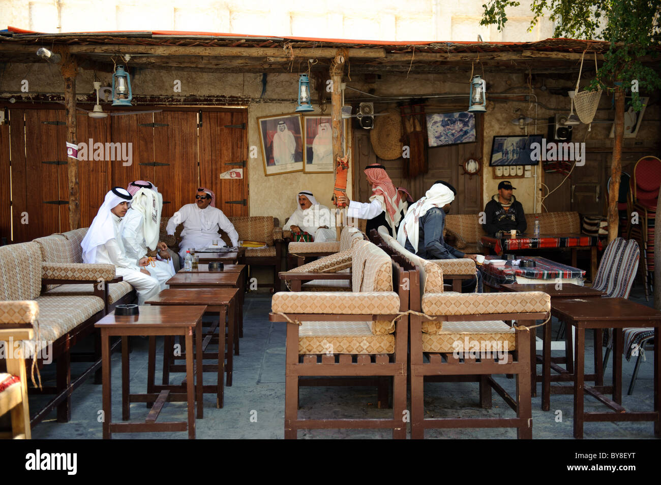 Local arab men relaxing in a cafe in Souq Waqif in Doha, in the state ...