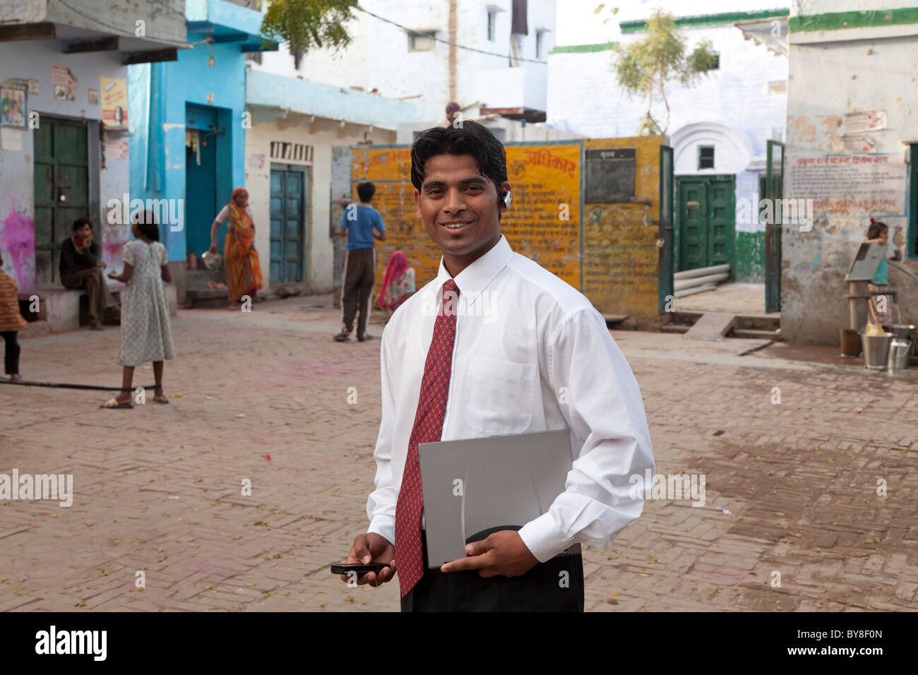 India, Uttar Pradesh, Agra, Indian businessman in suit and tie holding ...