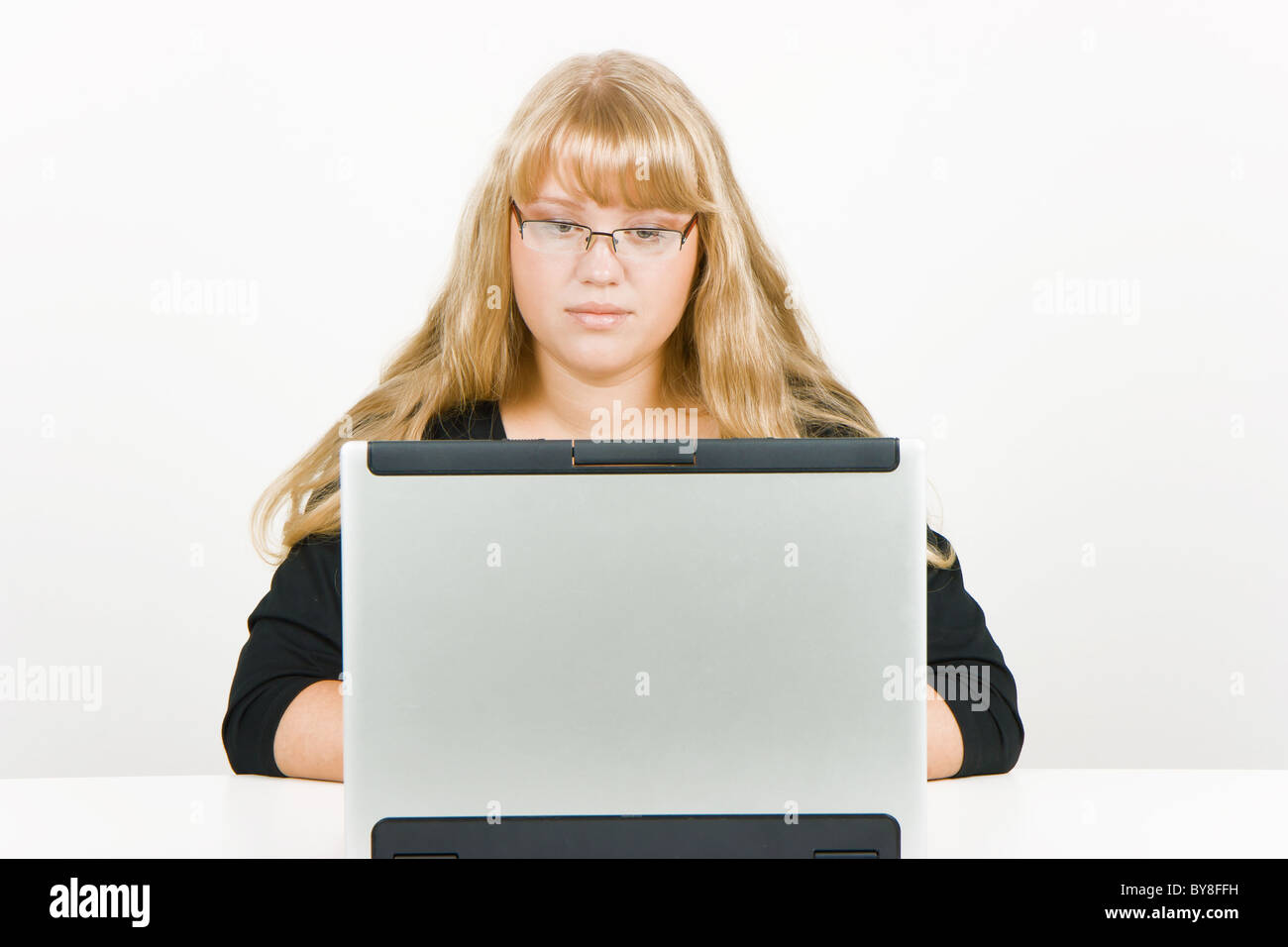 blonde with long beautiful hair with a laptop Stock Photo - Alamy