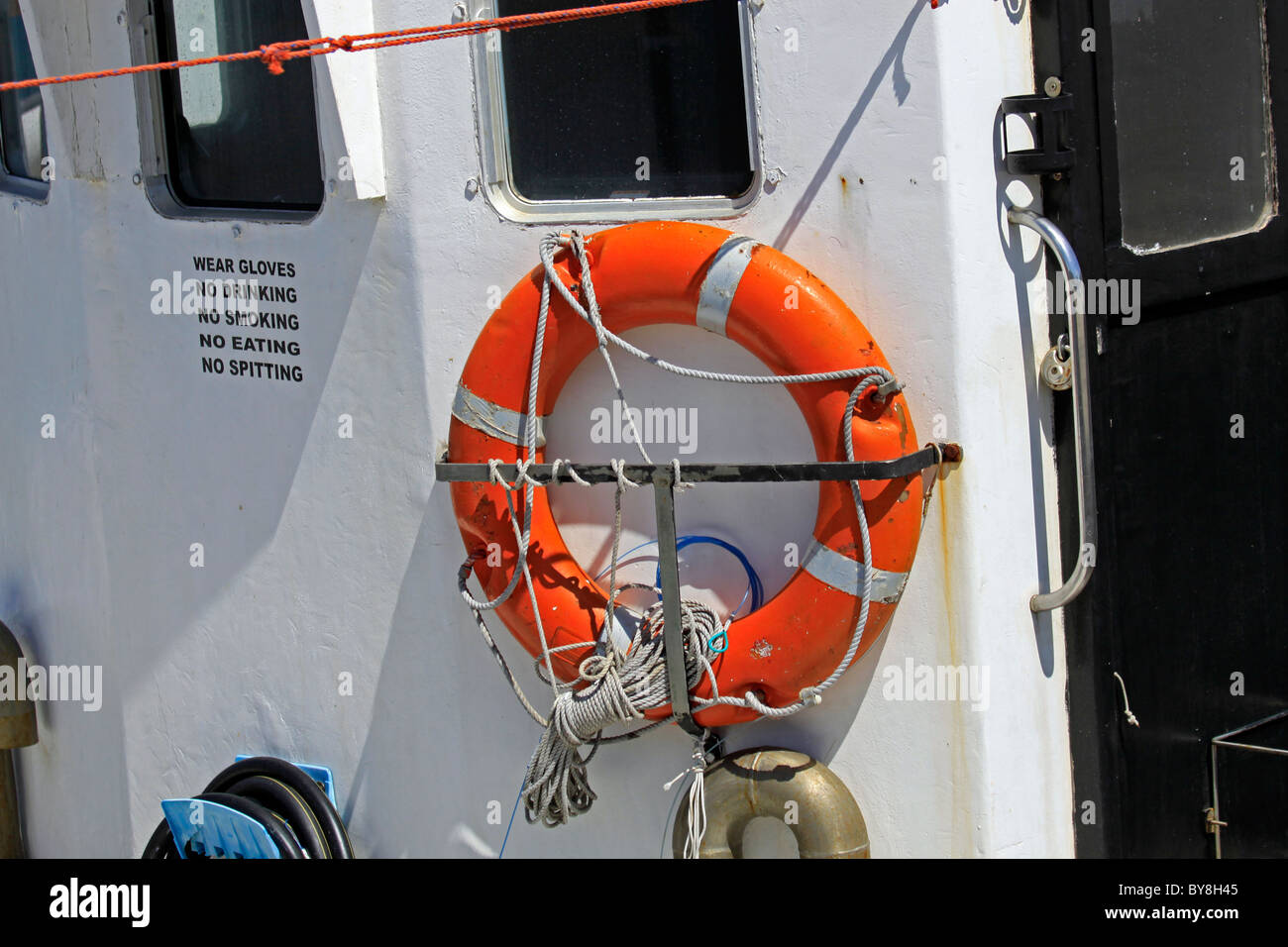Cabin on fishing boat with sign that shows general rules for the crew ...